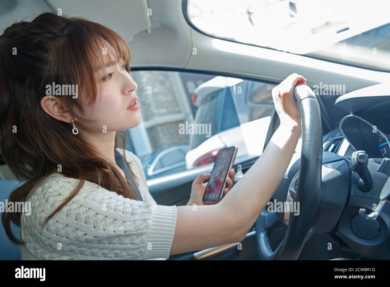 Side view chinese woman driving hi-res stock photography and images - Alamy