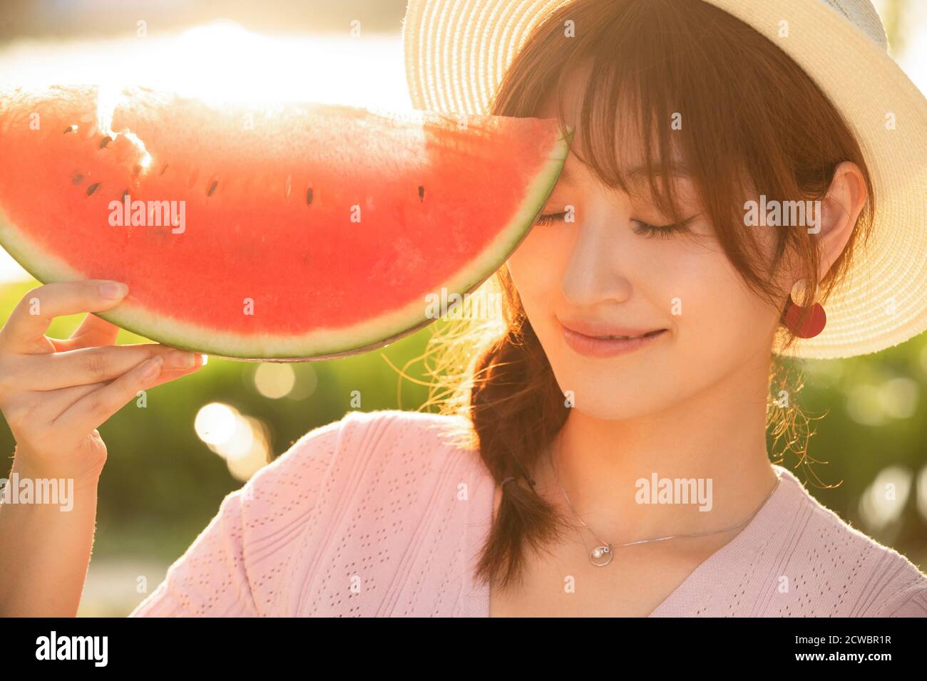 Holding watermelon happy young woman Stock Photo - Alamy