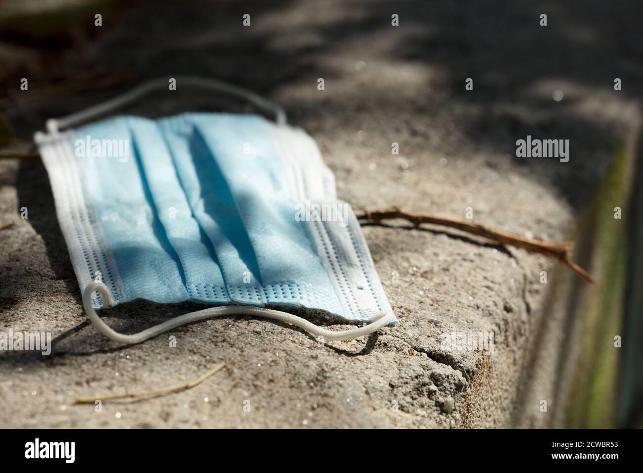 Medical protection mask lost on the ground was used. Disposable mask ...