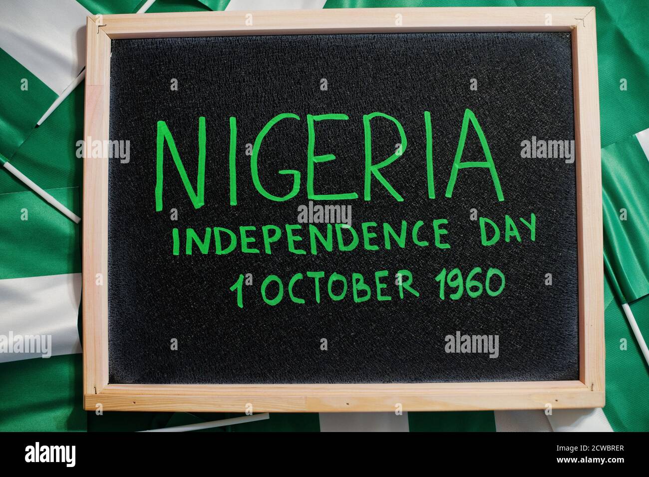 Happy independence day of Nigeria. 1 October 1960. Text on board with ...
