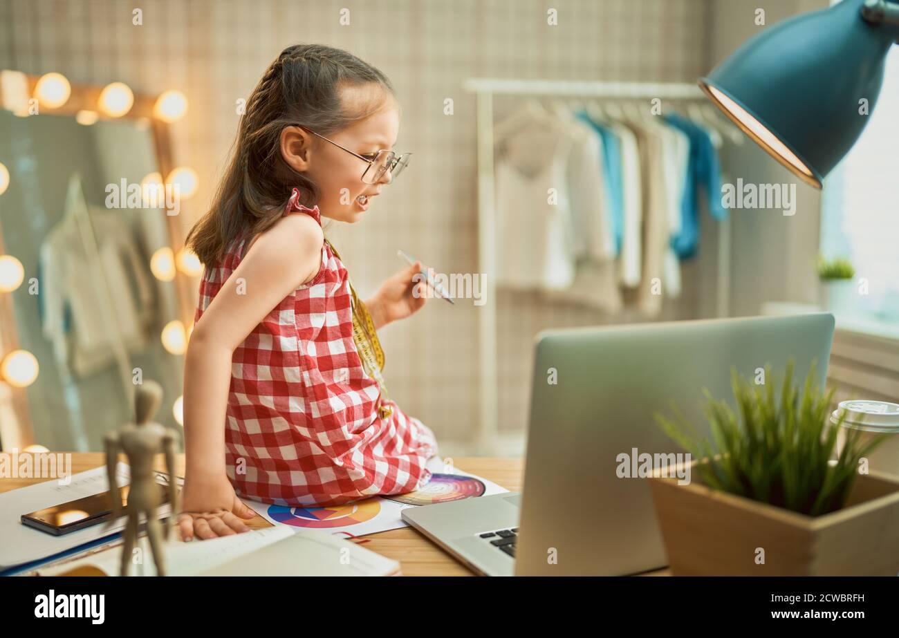 Cute baby girl working on a computer at home Stock Photo - Alamy