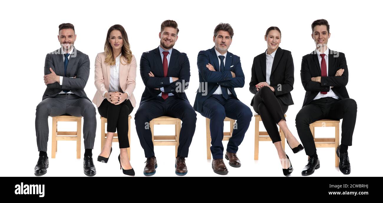 Team of 6 trustworthy businessmen smiling and looking forward while ...