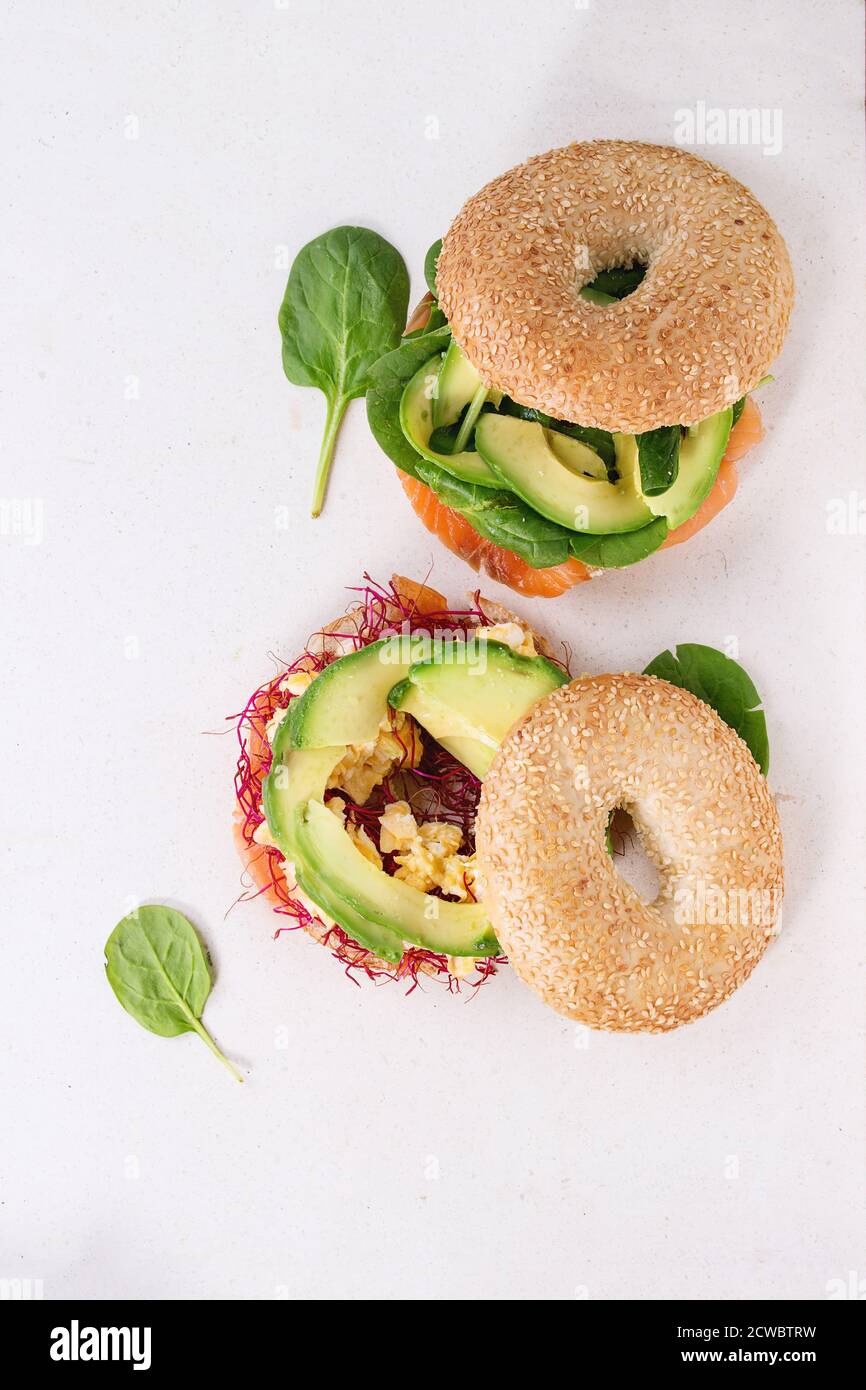 Two Bagels with salted salmon, spinach, beet sprouts, avocado and ...