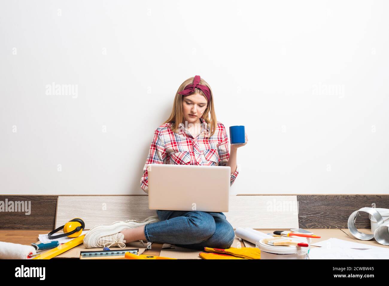 Beautiful girl using laptop computer at home Stock Photo - Alamy
