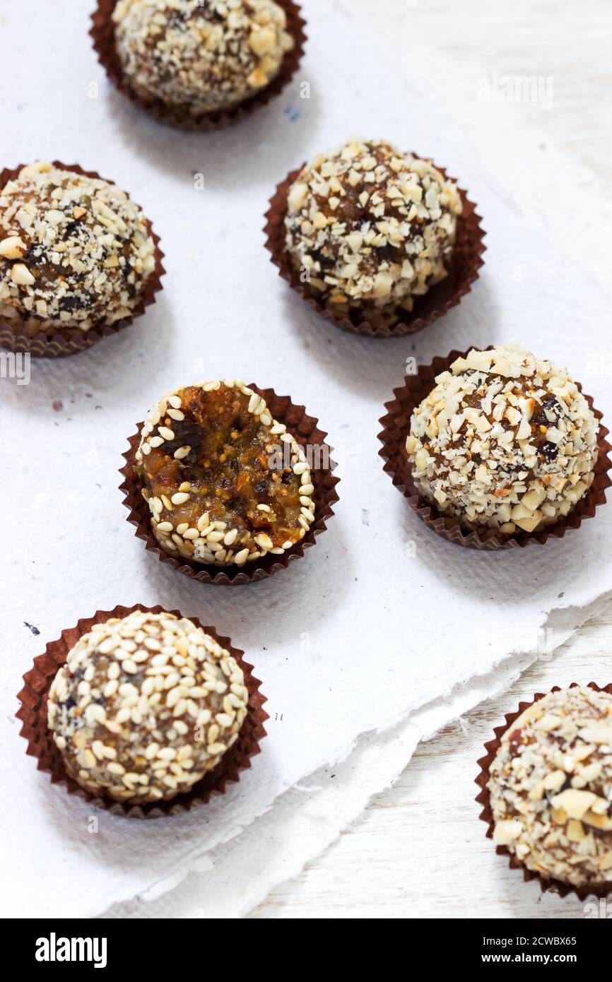 Homemade healthy candy made from dried fruits, honey and nuts. Rustic ...