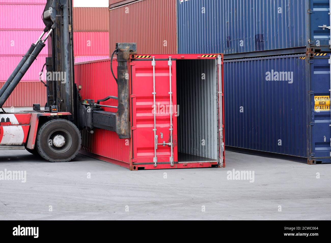Container handlers Manage containers in the ship Stock Photo - Alamy