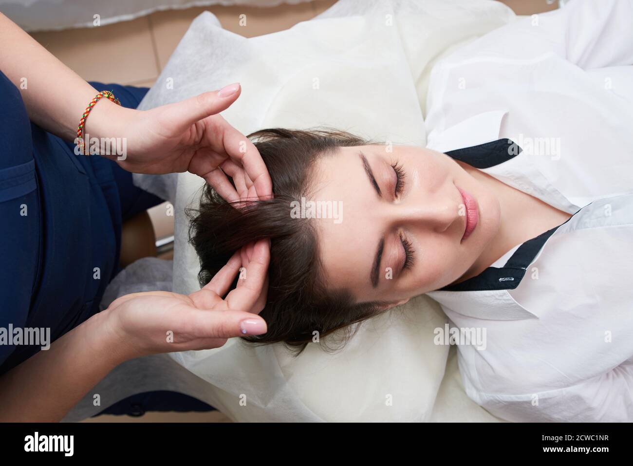 Beautiful Young Woman Getting a Face and head Treatment at Beauty Salon ...
