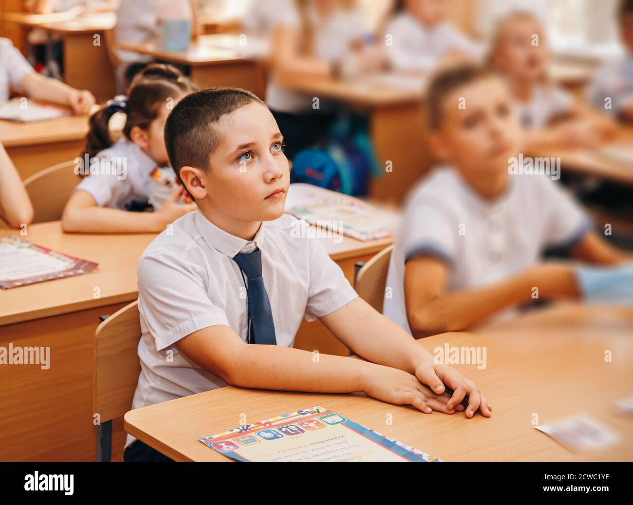 Portrait of beautiful school boy in elementary school classroom Stock ...