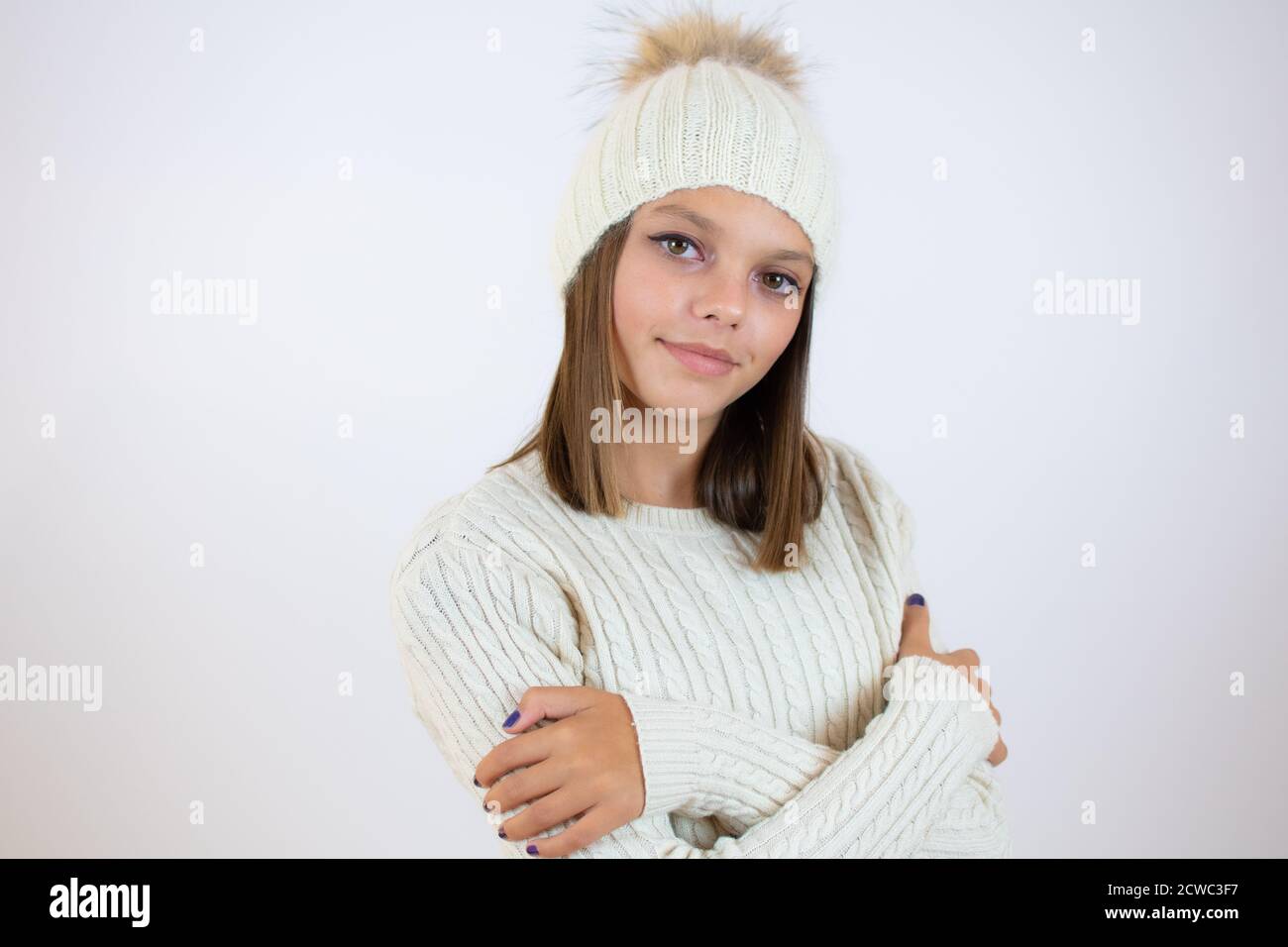 Portrait of a pretty girl in winter clothes over white background Stock ...