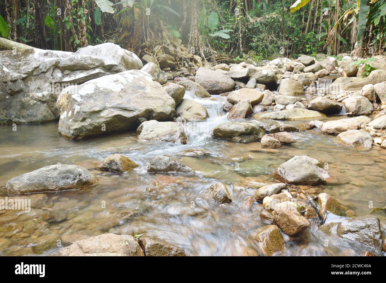 Waterfall pass through rock hi-res stock photography and images - Alamy