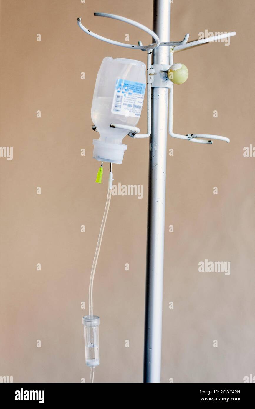 Close-up bottle of medicine on dropper system in the operating room ...