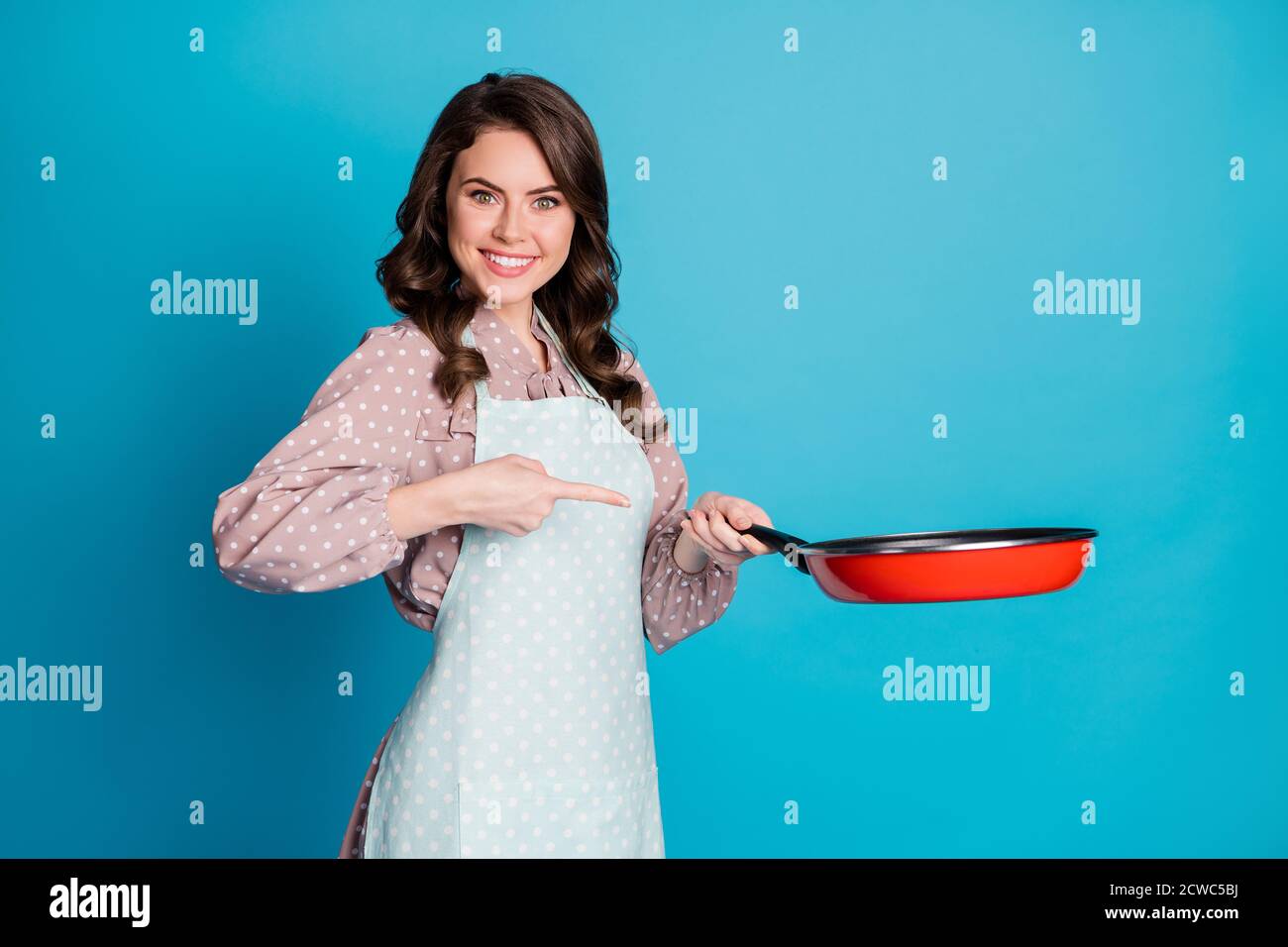 Photo of attractive pretty house wife lady hold hands kitchen frying ...