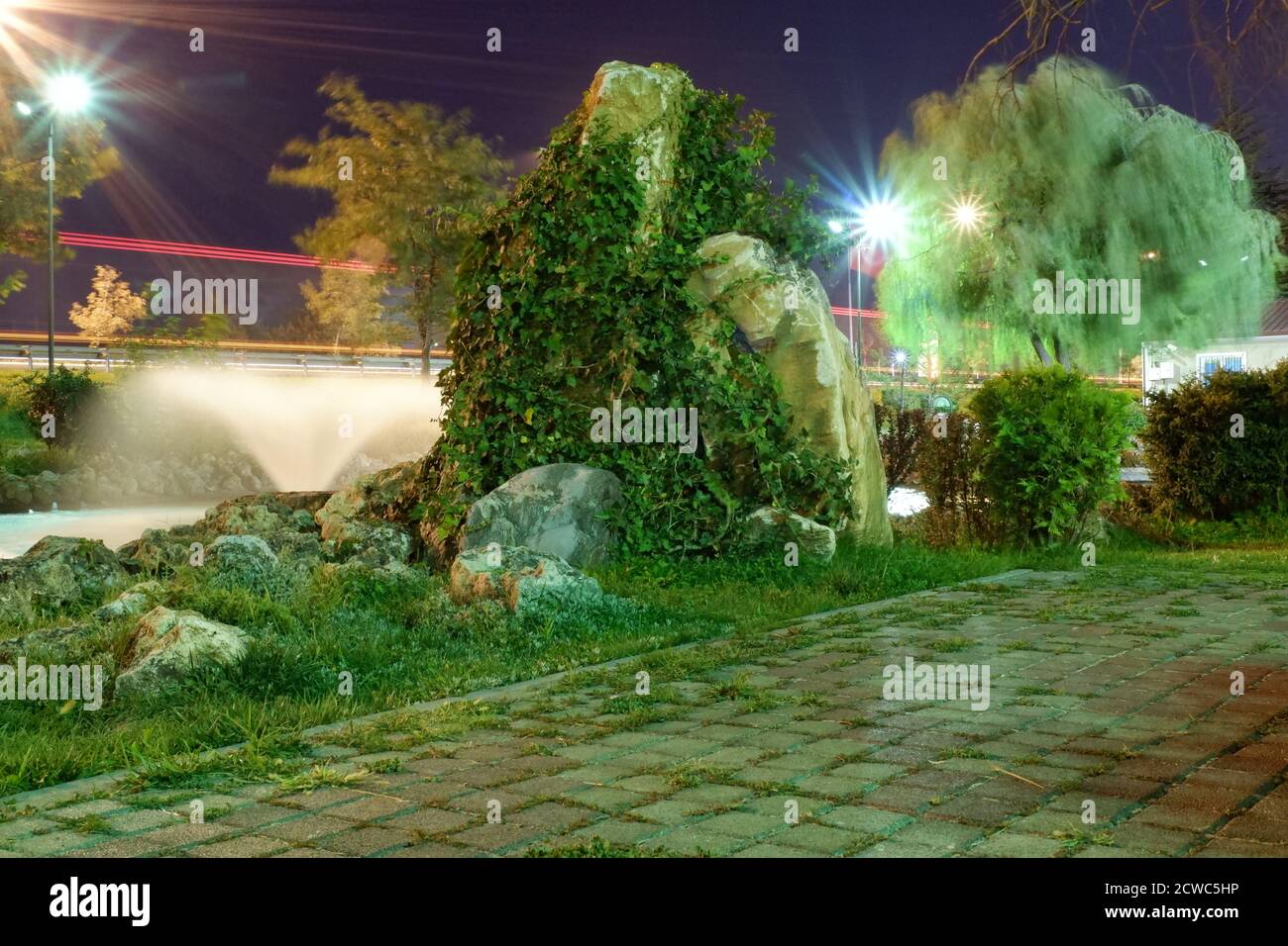 Stones in the park at night with long exposure Stock Photo - Alamy