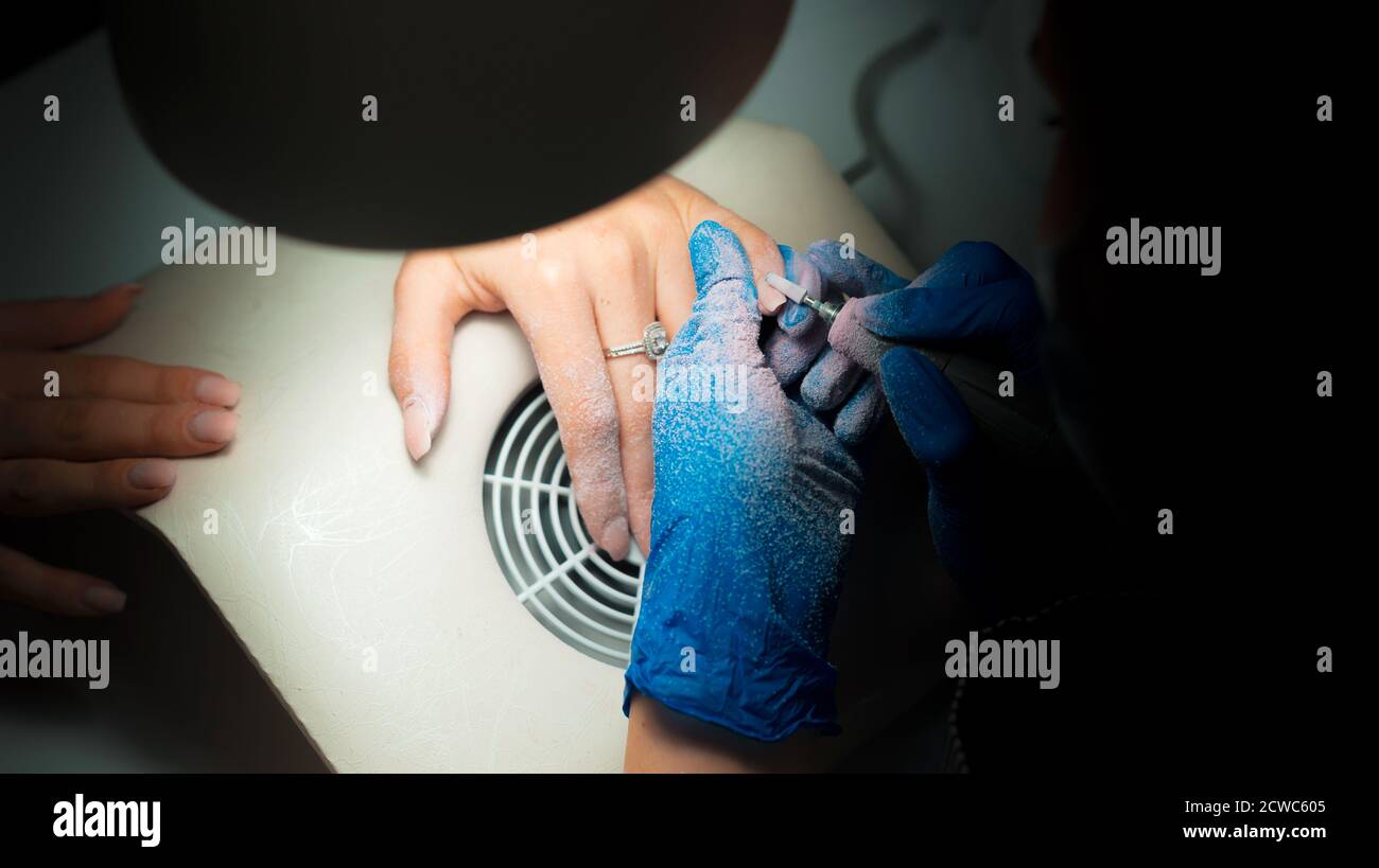 Girl getting a manicure hi-res stock photography and images - Alamy