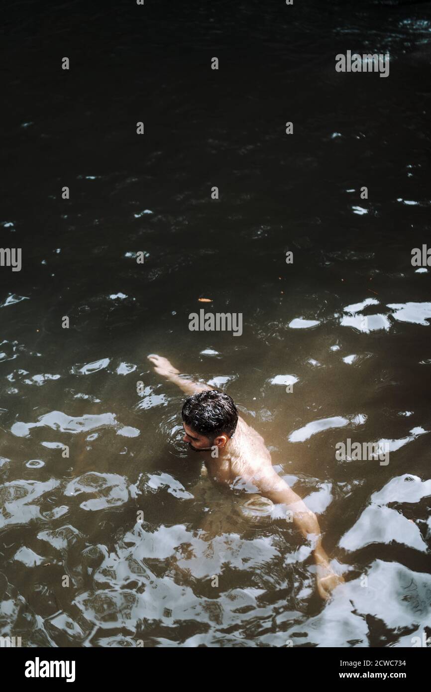 Young male swimming in a river Stock Photo - Alamy