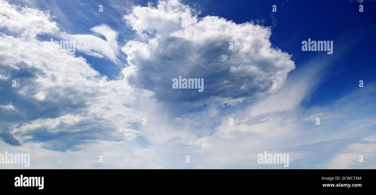 Beautiful dark clouds slowly flying in the sky. Wide photo Stock Photo ...