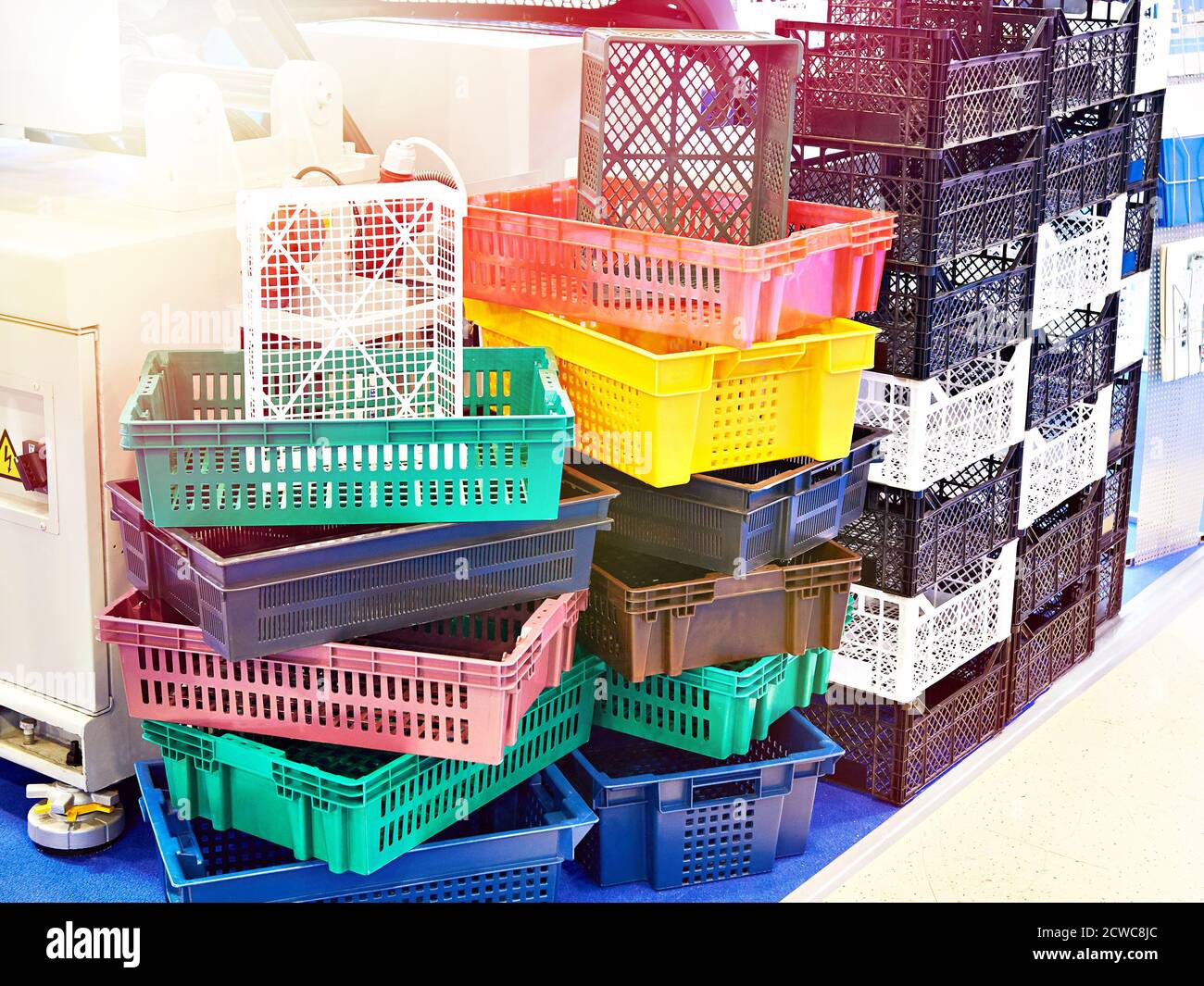Plastic containers for goods in production Stock Photo - Alamy
