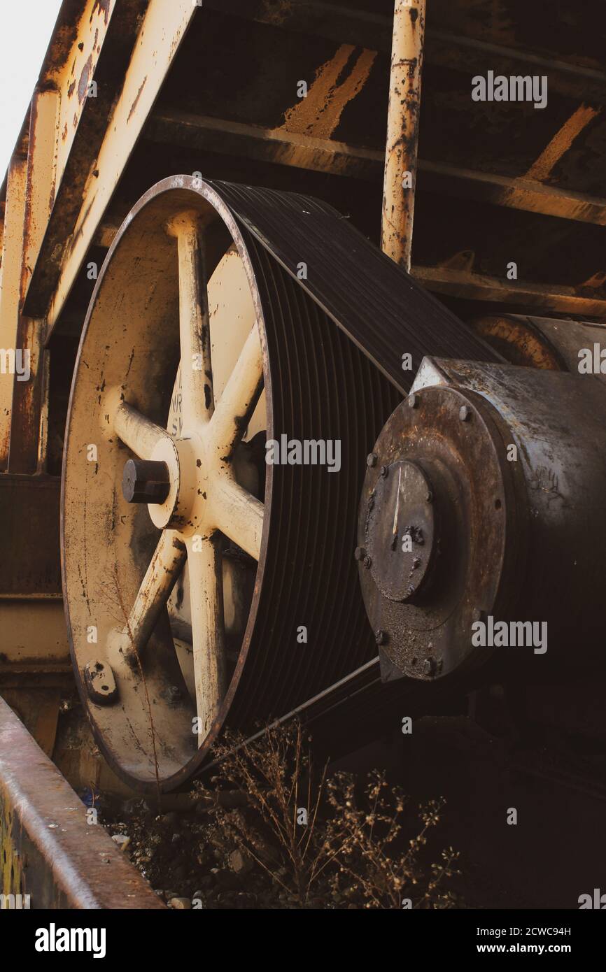 The wheel of a large machine Stock Photo - Alamy