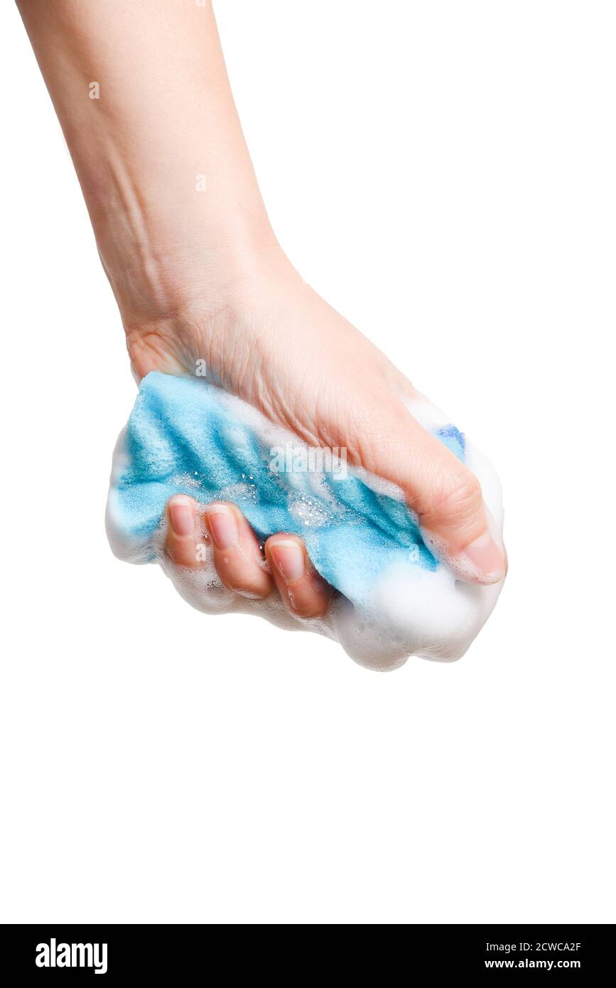 Sponge for washing dishes in hand isolated on white background ...