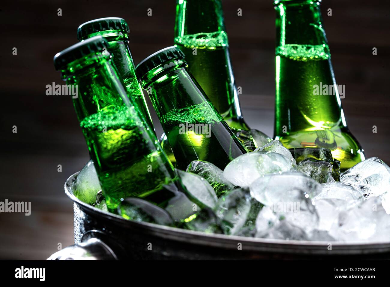 Chilled glass bottles of beer and ice Stock Photo - Alamy