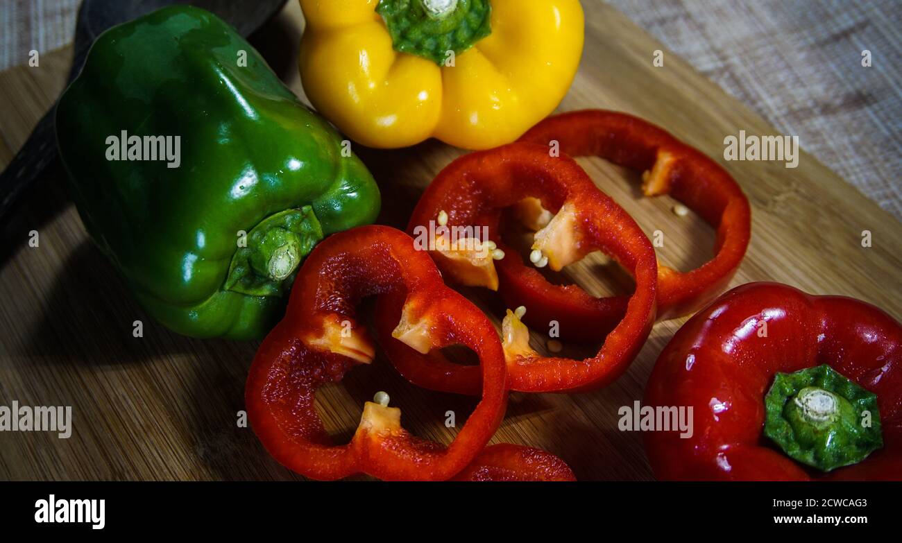 Colorful capsicum on wooden table background Stock Photo - Alamy