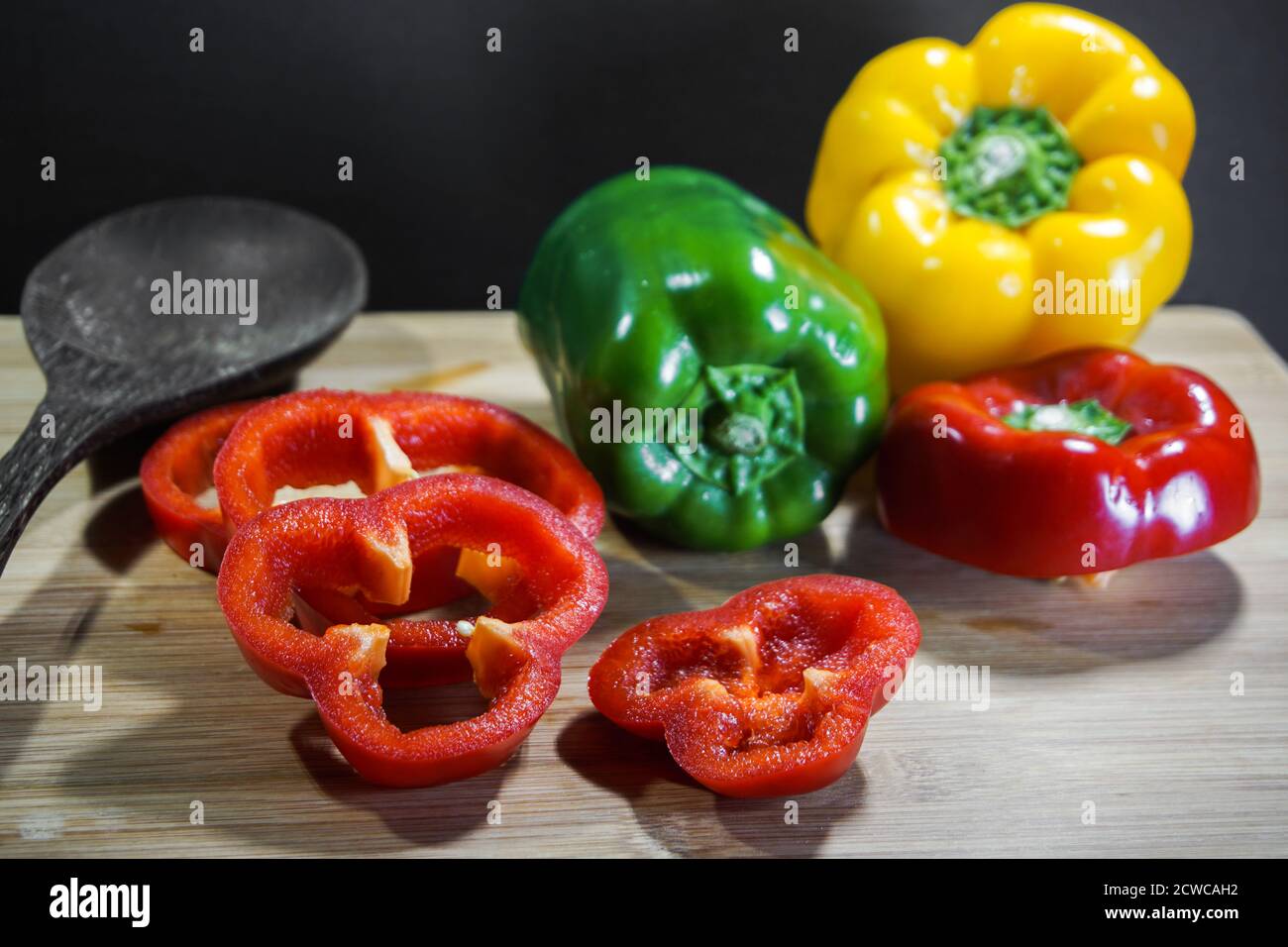 Colorful capsicum on wooden table background Stock Photo - Alamy