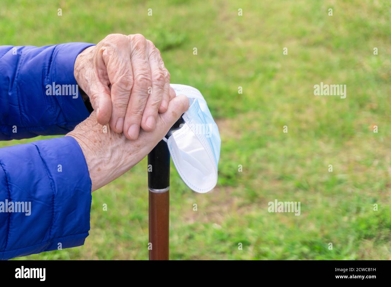 Old lady with walking stick hi-res stock photography and images - Alamy