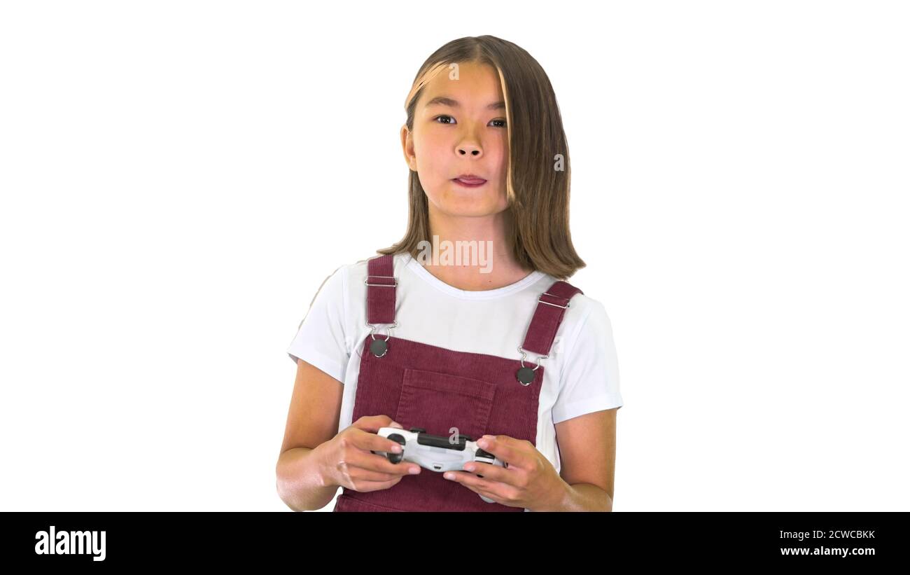 School girl playing video game on white background Stock Photo - Alamy