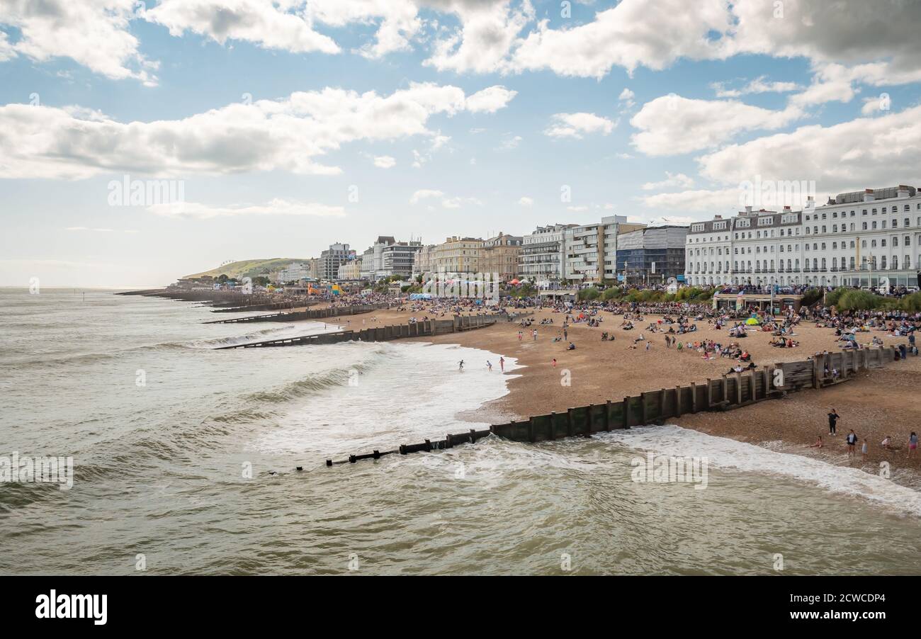 Eastbourne seafront, East Sussex, England. A busy beach scene at the ...