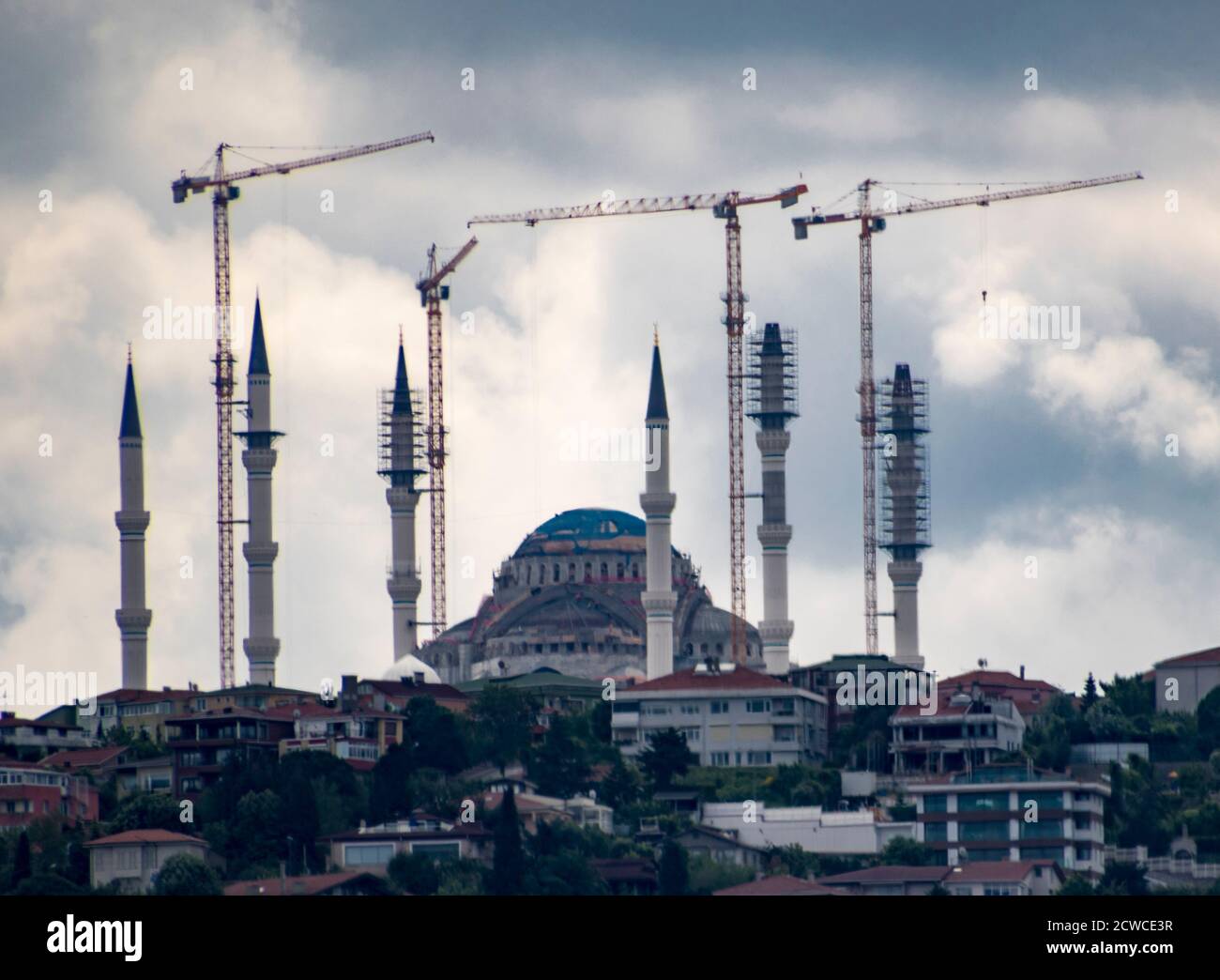 Construction cranes can be seen as mosque is being restored in Istanbul ...