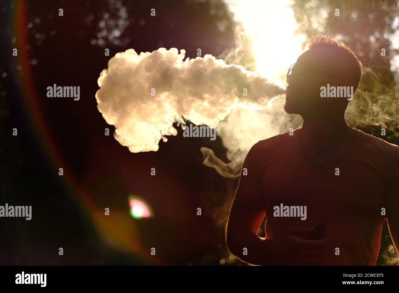 Vaper with beard with electronic cigarette outdoor Stock Photo - Alamy