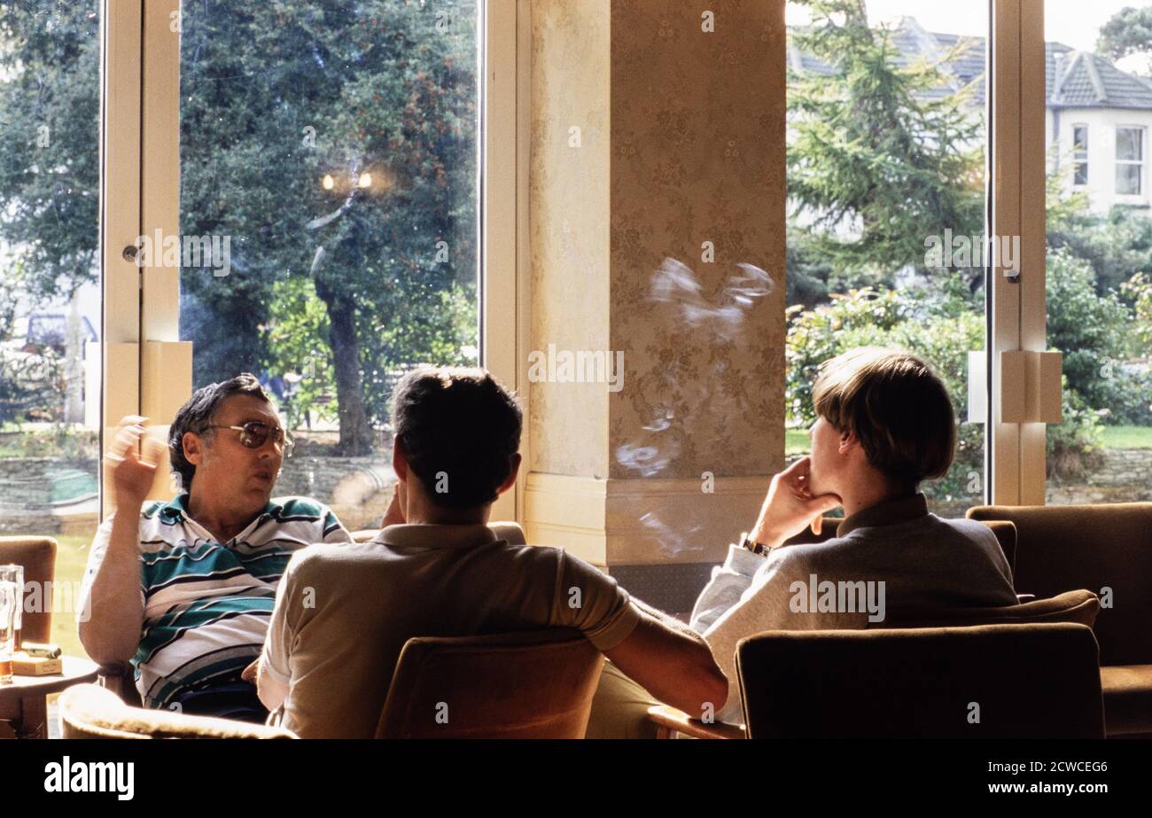 Customers smoking and drinking in a hotel bar in Bournemouth . 09 ...