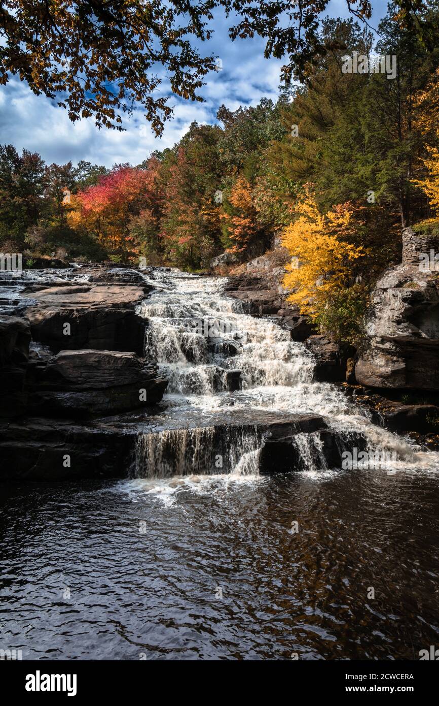 Brilliant fall foliage surrounds the beautiful cascading Shohola Falls ...