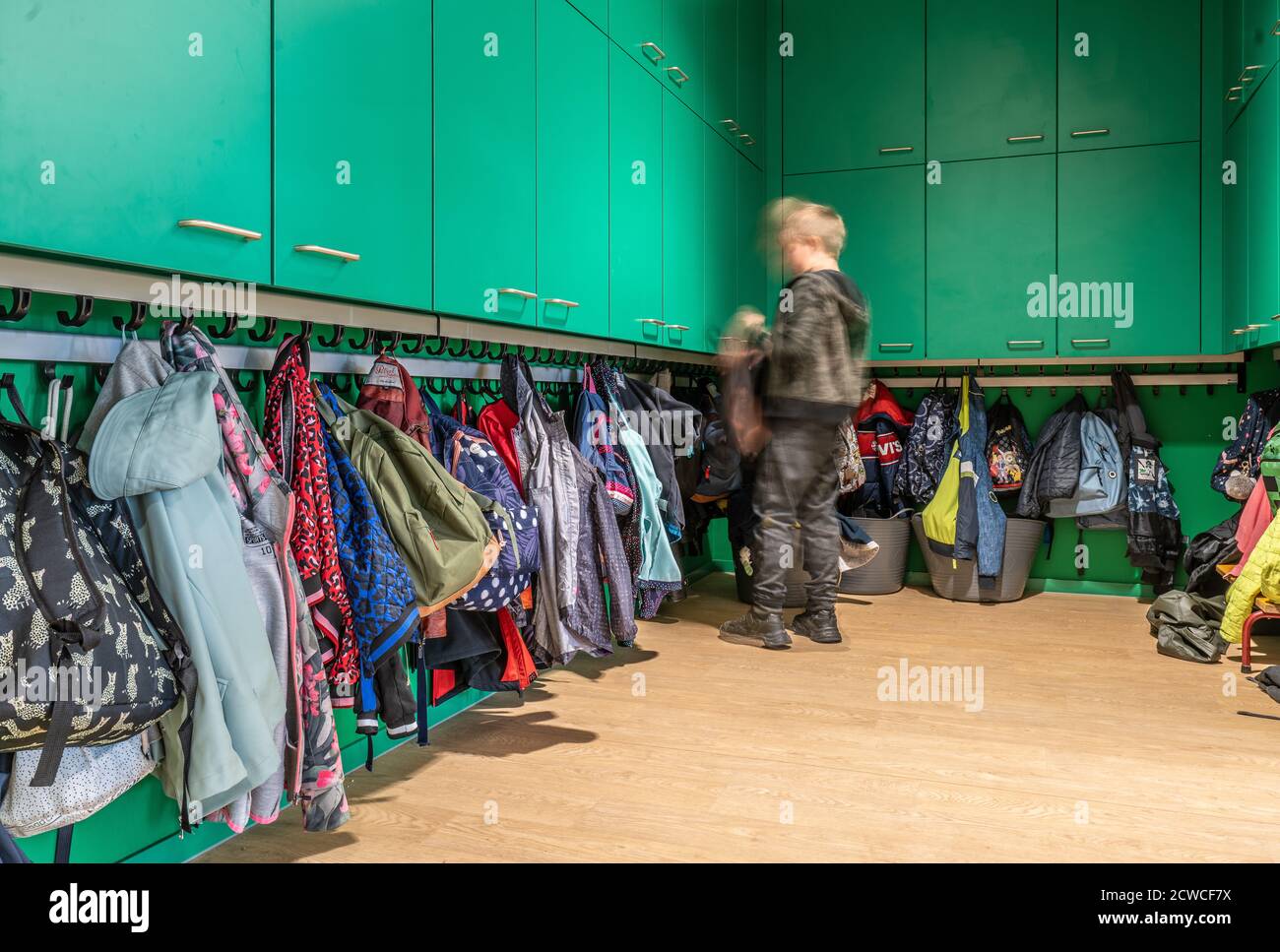 Girl in school cloakroom hi-res stock photography and images - Alamy