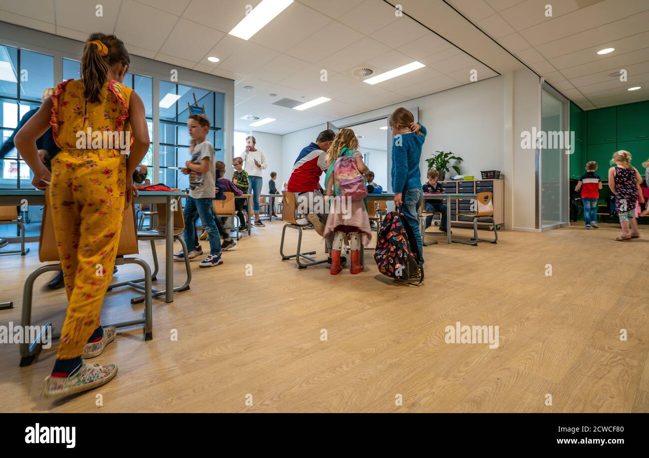 ARNHEM / NETHERLANDS - AUGUST 28 2020: Children in primary school work ...