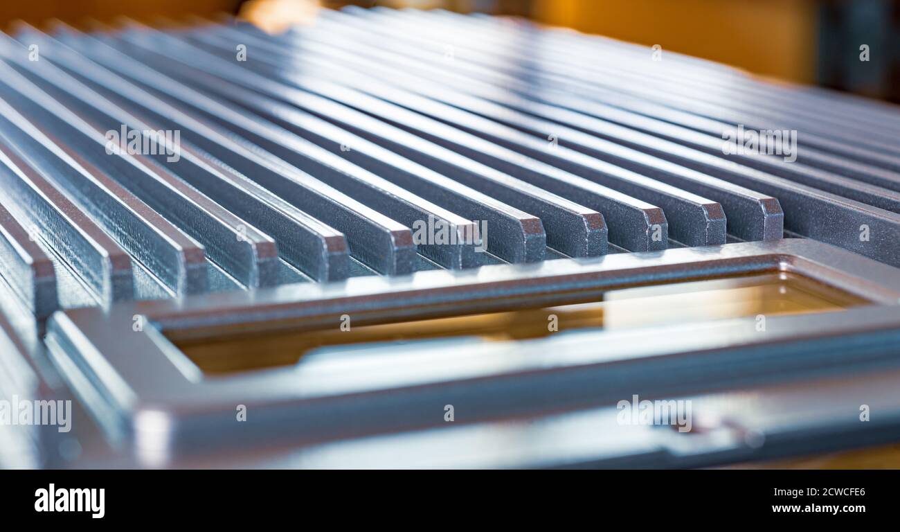 Close-up of a fluted metal surface with bolt hole on an unidentified ...