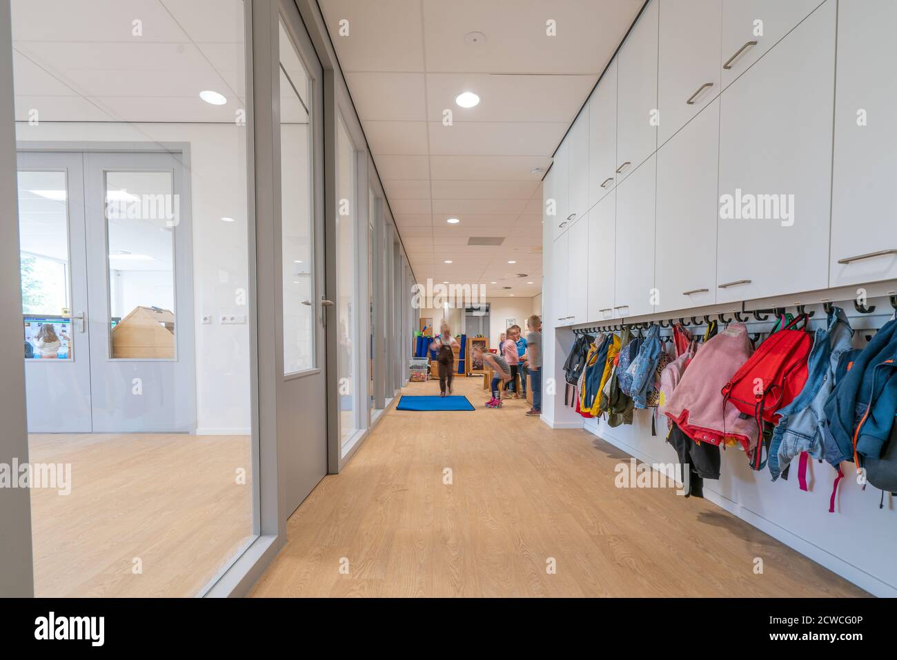 Girl in school cloakroom hi-res stock photography and images - Alamy