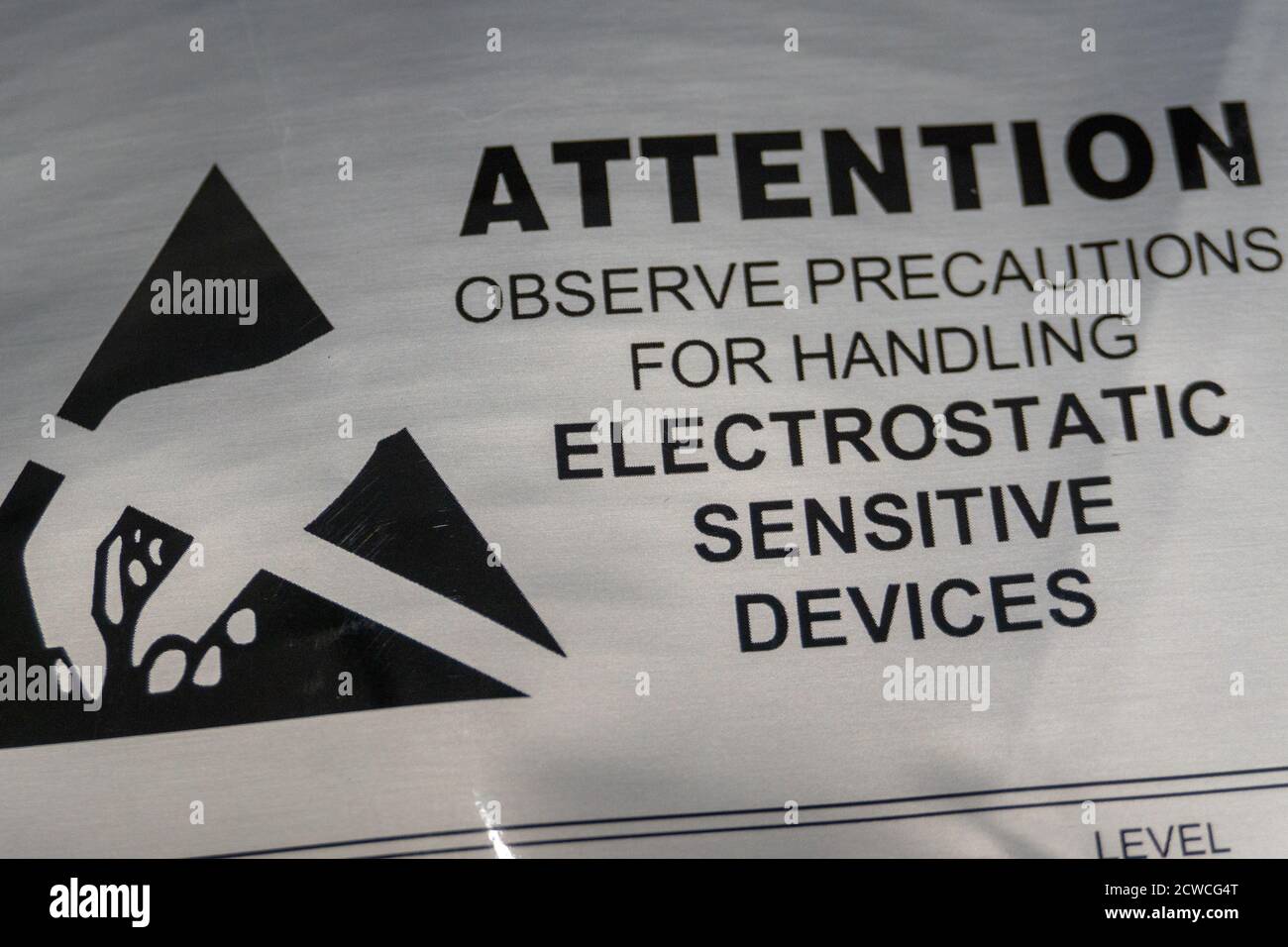 Close-up of ESD protected moisture barrier vacuum bag caution warning ...