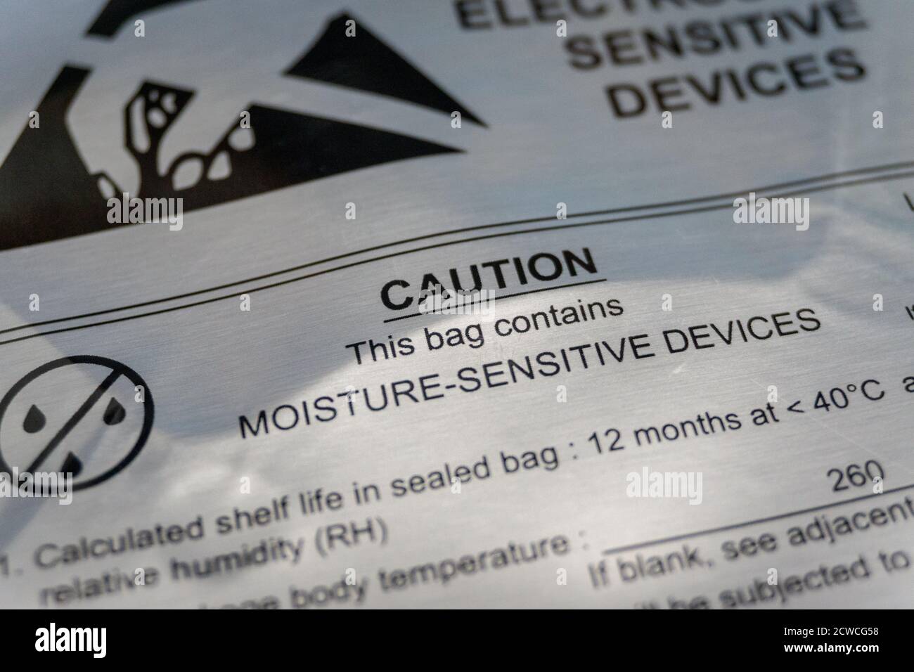 Close-up of moisture barrier bag caution warning label from electronics ...