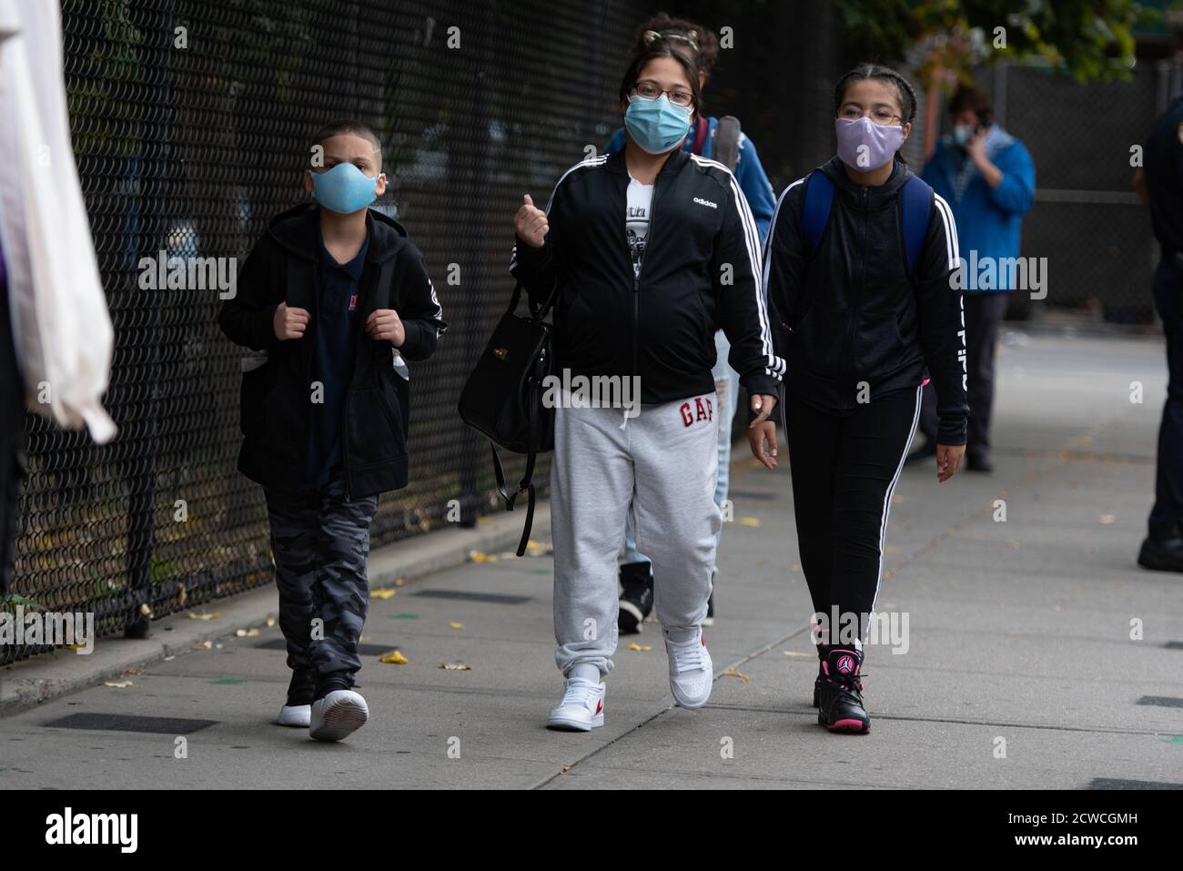Elementary school students are welcomed back to P.S. 188 as the city's ...