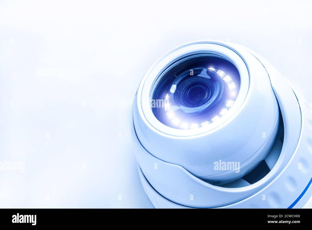 Security CCTV camera, tinted image in blue tones. Biometrical scan ...