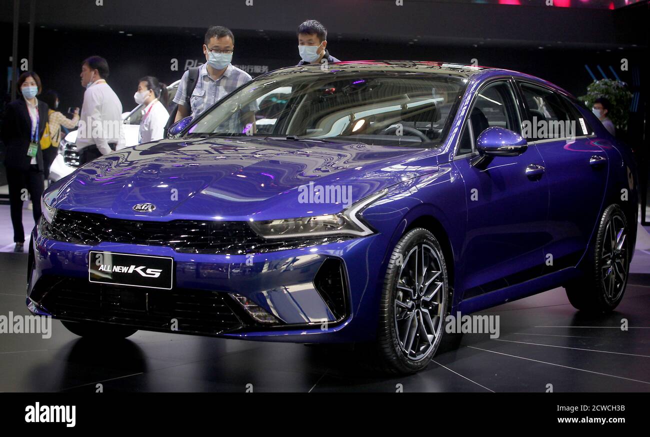 Beijing, China. 29th Sep, 2020. Chinese check out KIA's new KS sports ...