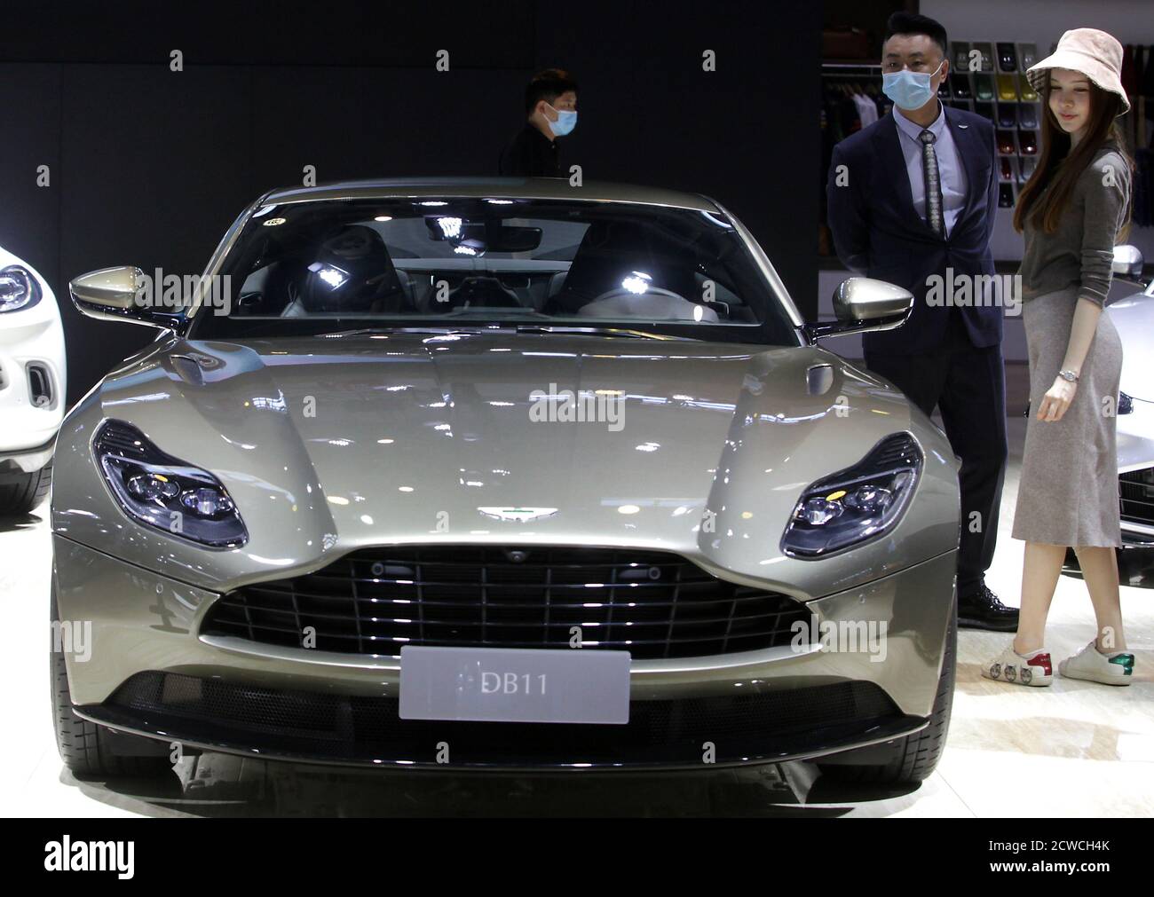 Beijing, China. 29th Sep, 2020. A Chinese woman is shown an Aston ...