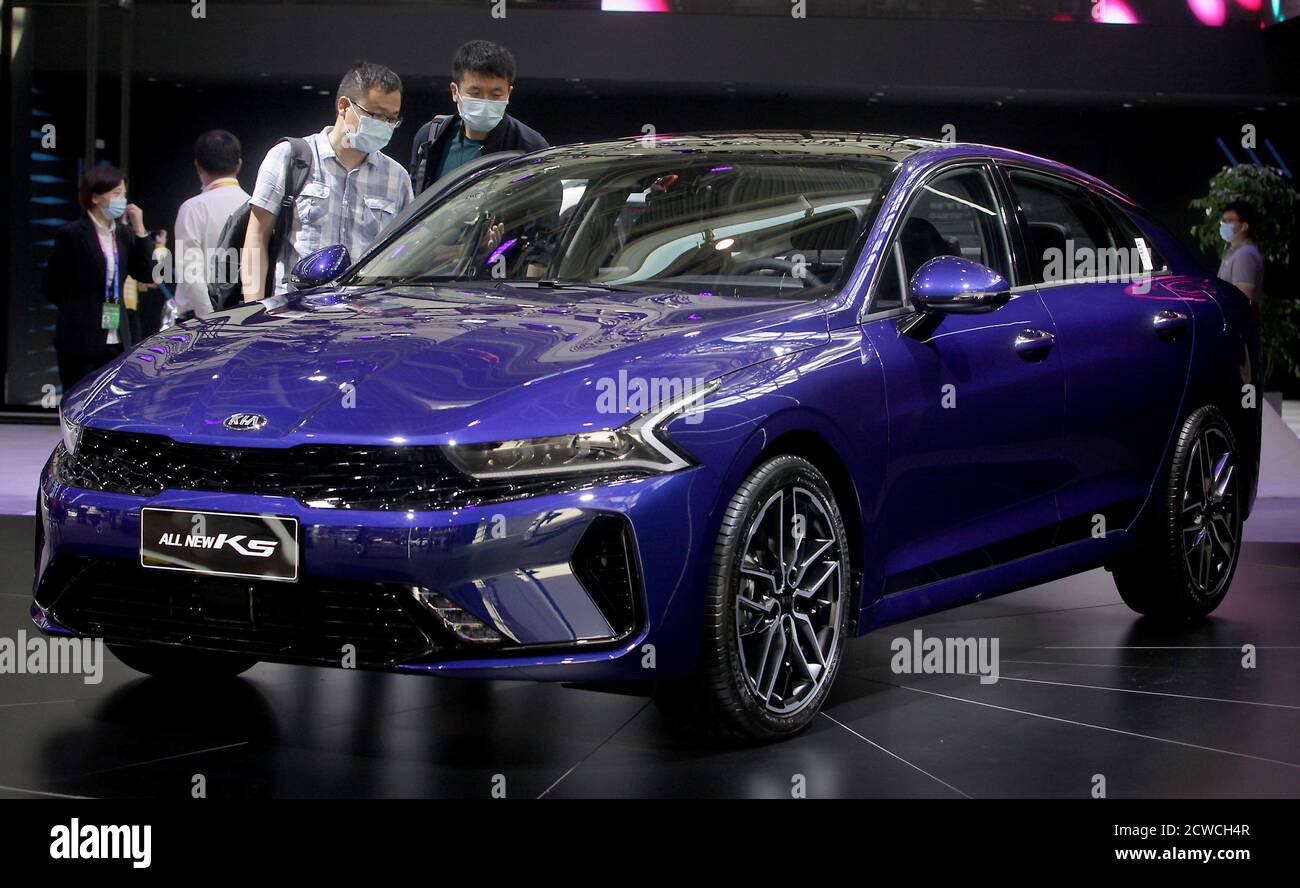 Beijing, China. 29th Sep, 2020. Chinese check out KIA's new KS sports ...