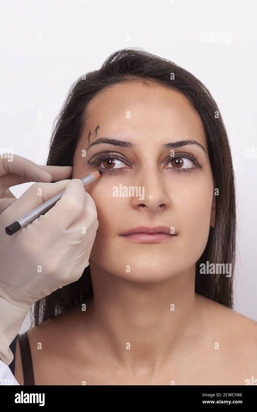 Vertical closeup shot of a woman preparing her face for a plastic ...