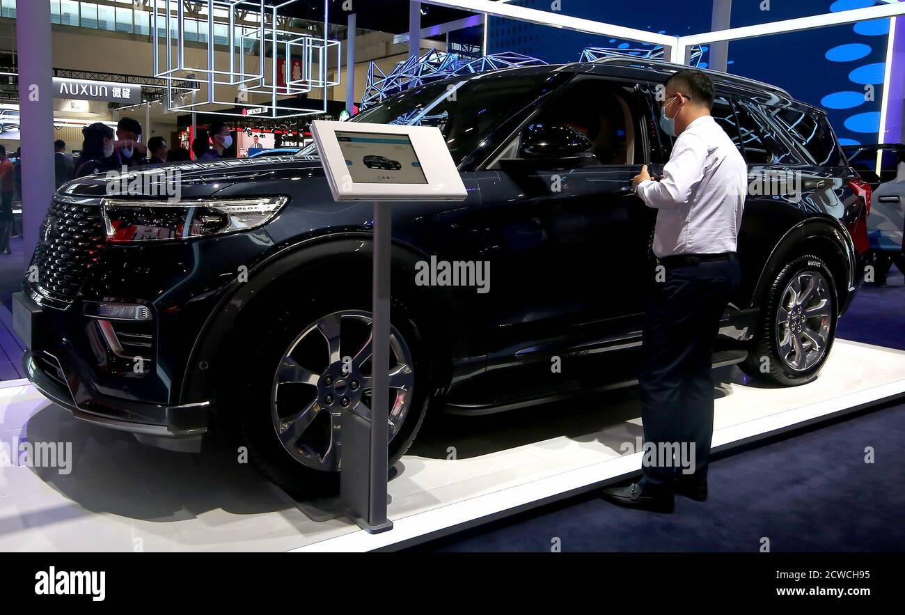 Beijing, China. 29th Sep, 2020. Chinese check out the new Ford Explorer ...