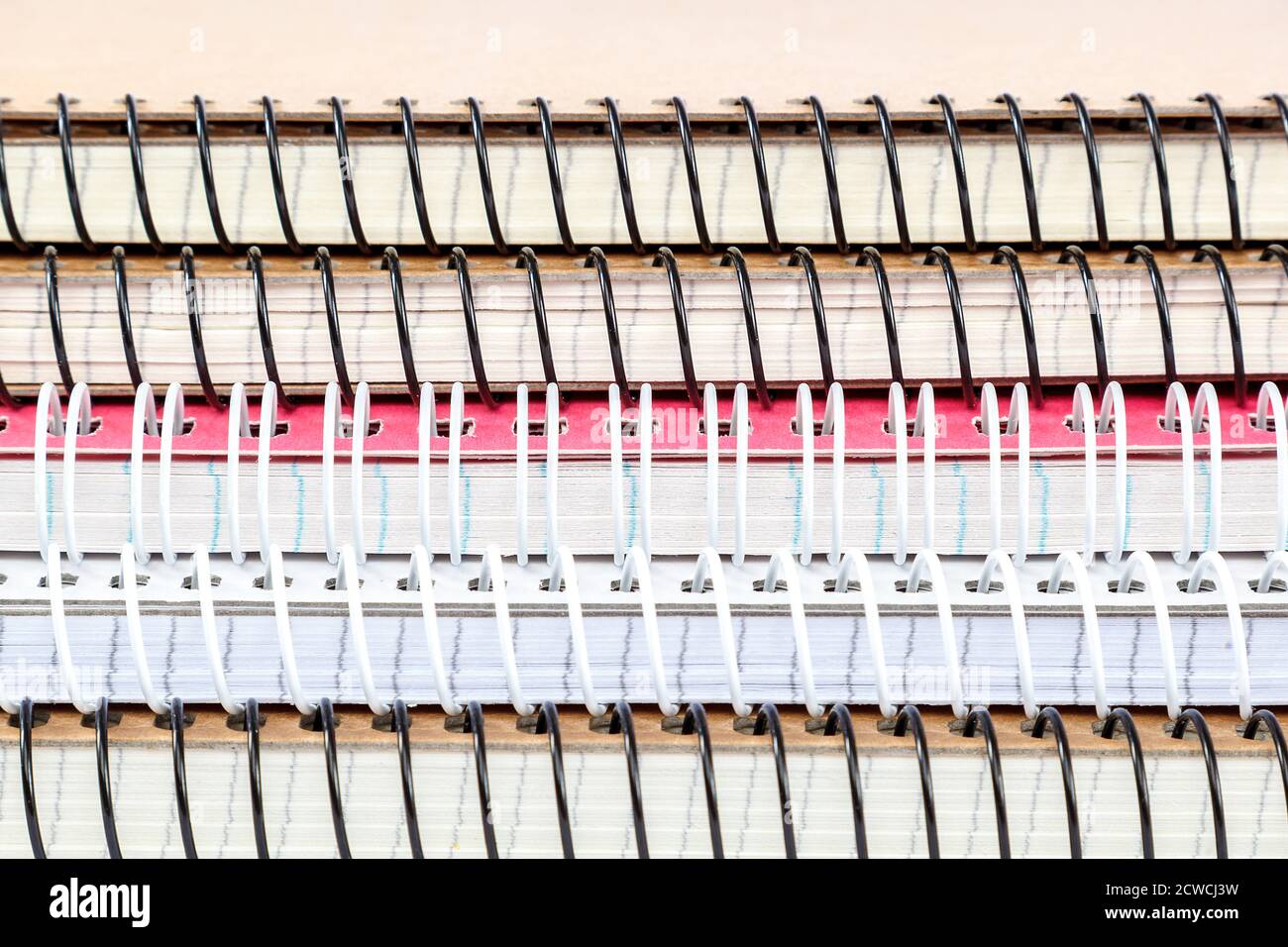 Stack spring notebooks isolated on white background Stock Photo - Alamy