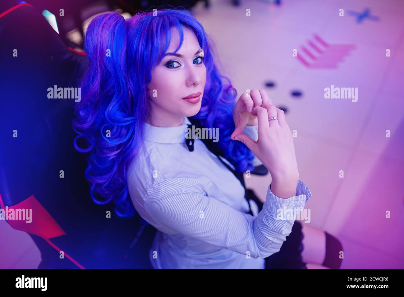 Young woman streamer anime cosplay professional gamer playing video ...