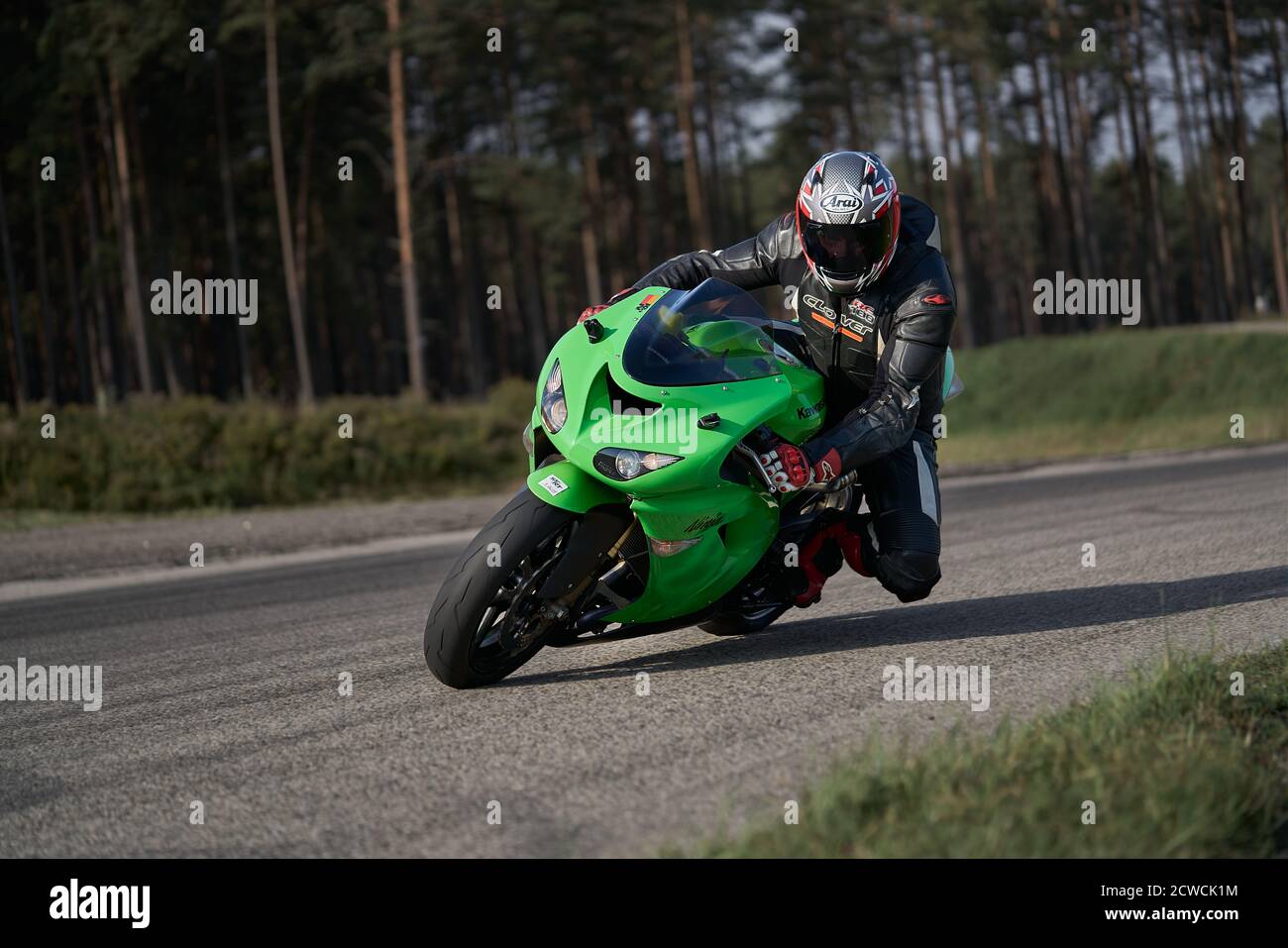 Handsome motorcyclist riding his super sport motorcycle Stock Photo - Alamy