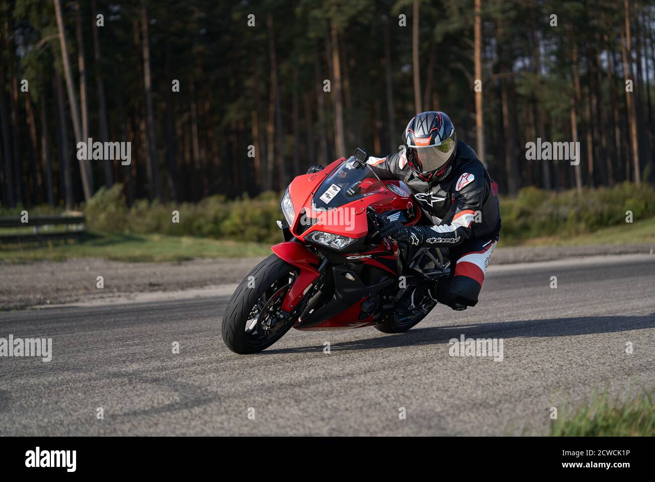 Handsome motorcyclist riding his super sport motorcycle Stock Photo - Alamy